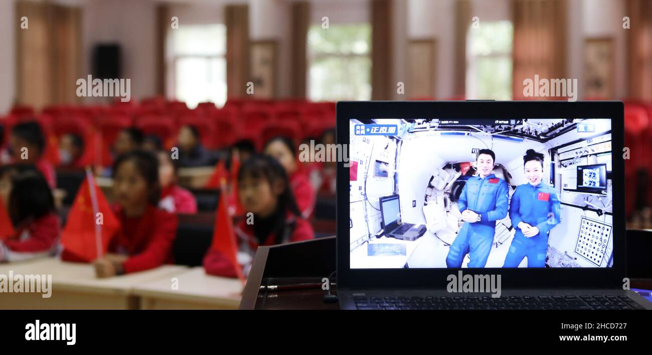 CHONGQING, CHINA - DECEMBER 9, 2021 - Students watch the first class of ...