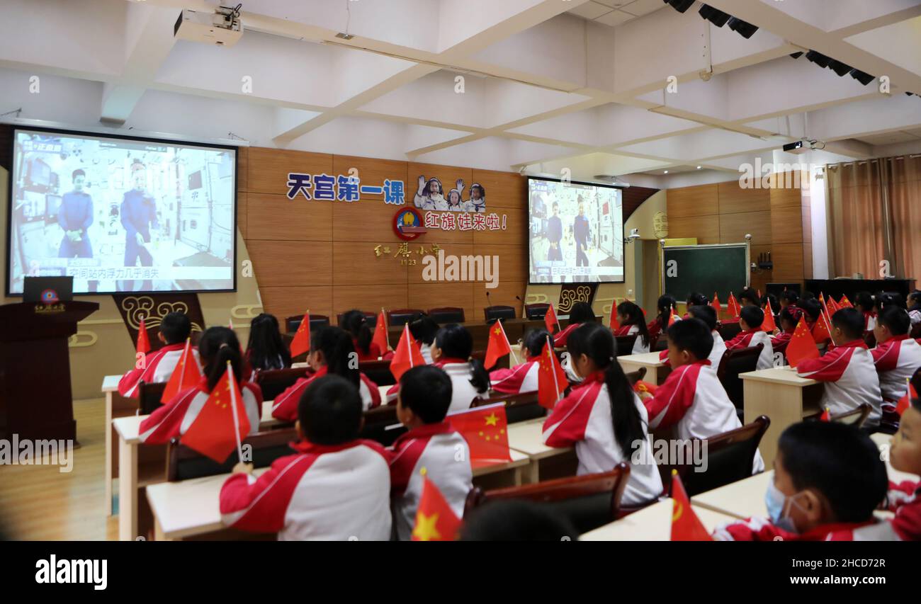 CHONGQING, CHINA - DECEMBER 9, 2021 - Students watch the first class of ...