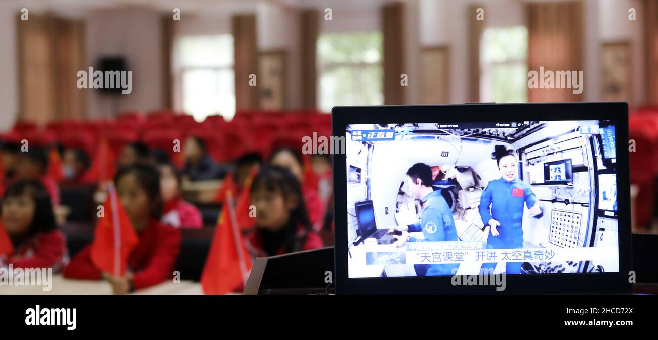 CHONGQING, CHINA - DECEMBER 9, 2021 - Students watch the first class of ...