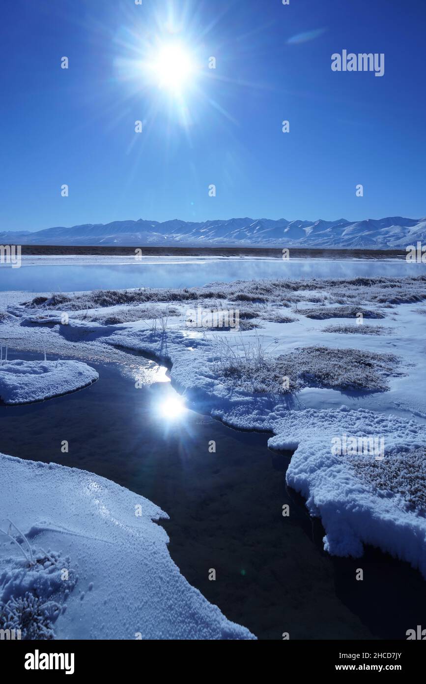 BAZHOU, CHINA - DECEMBER 11, 2021 - Snow-capped mountains and a snow ...