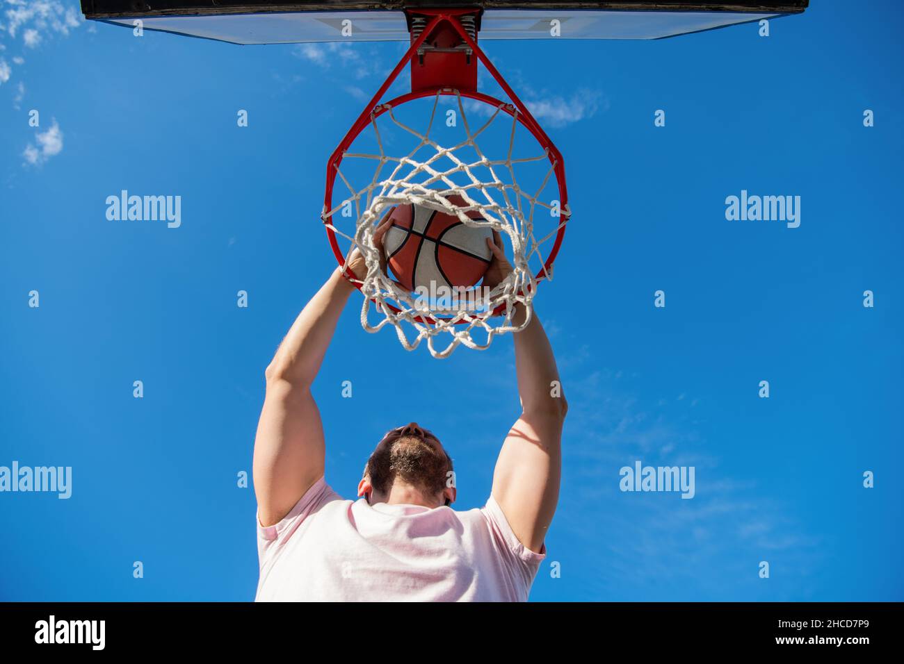 top view of basketball player throws the ball into the hoop outdoor ...