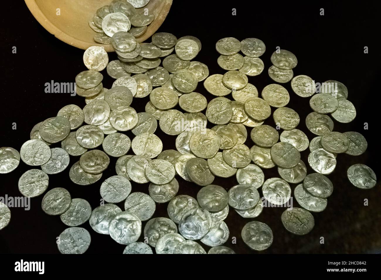 Treasury of ancient Greek silver coins on dark background Stock Photo ...