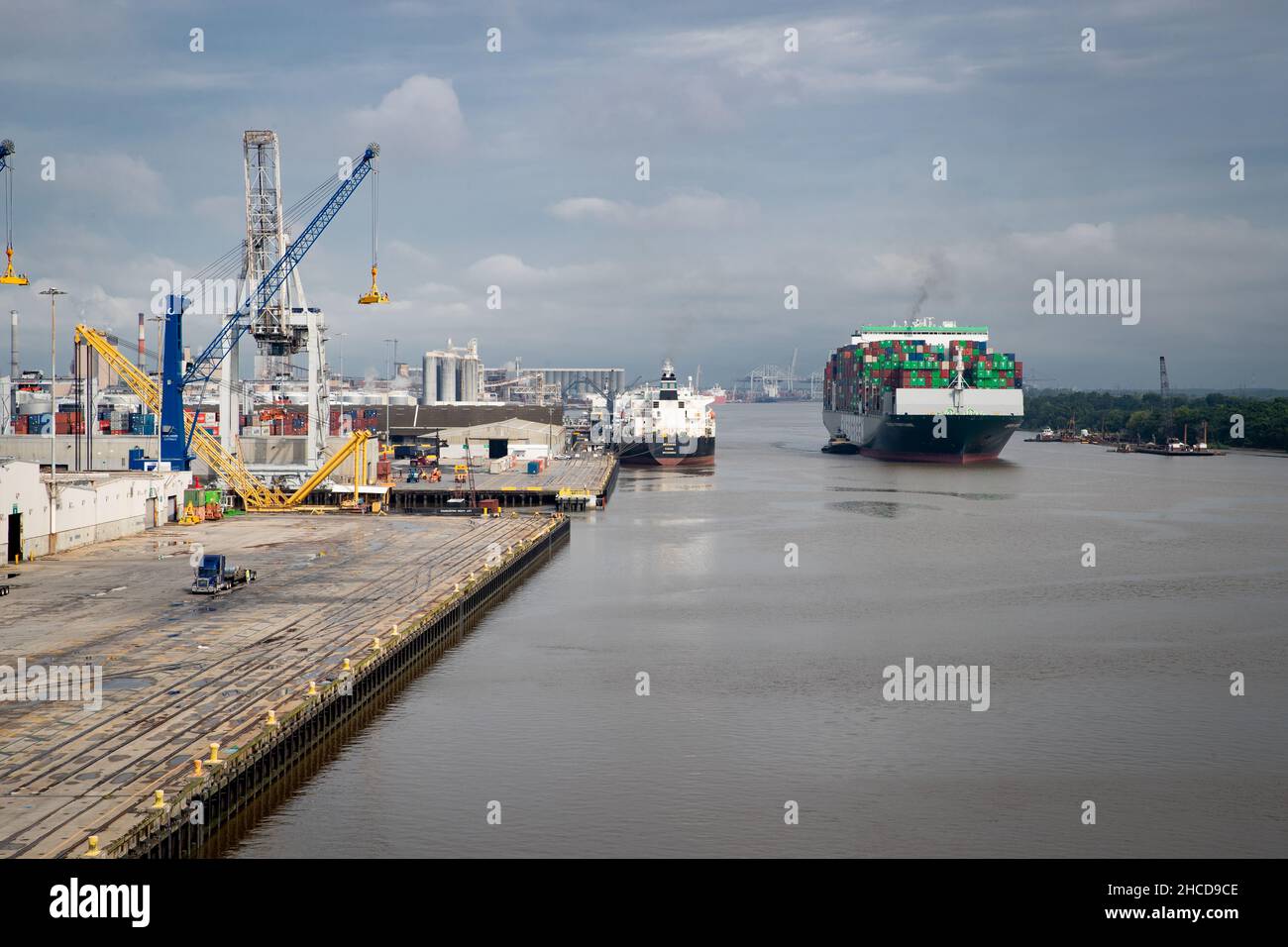 A container ship in the Savannah River departs the Port of Savannah ...