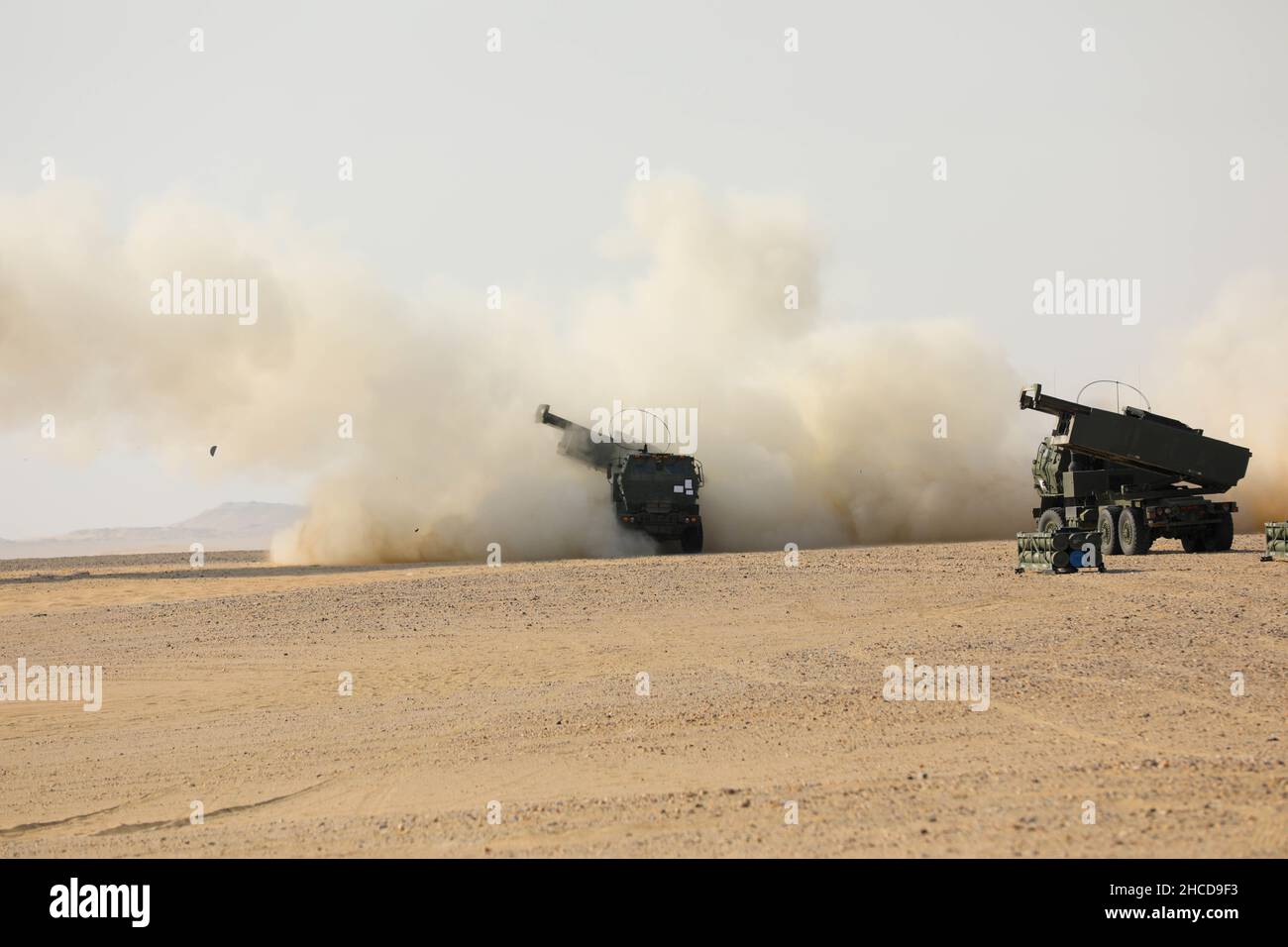 Two U.S. Marine Corps High Mobility Artillery Rocket Systems, assigned ...