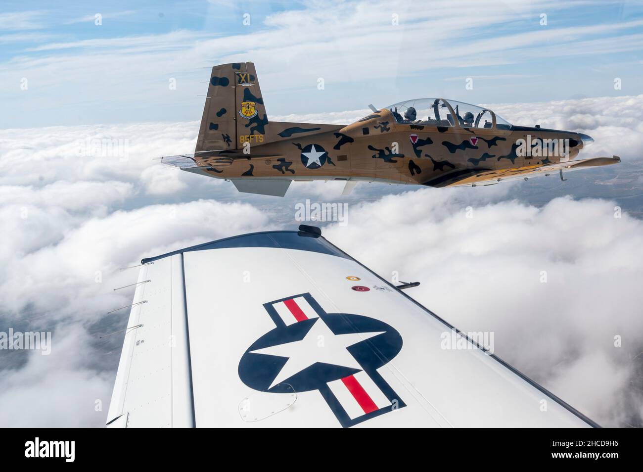 A Texan II T-6 flies through the air as it performs standard training ...