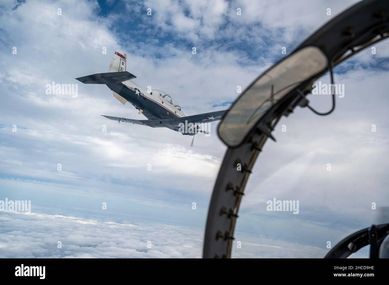 A Texan II T-6 flies through the air as it performs standard training ...