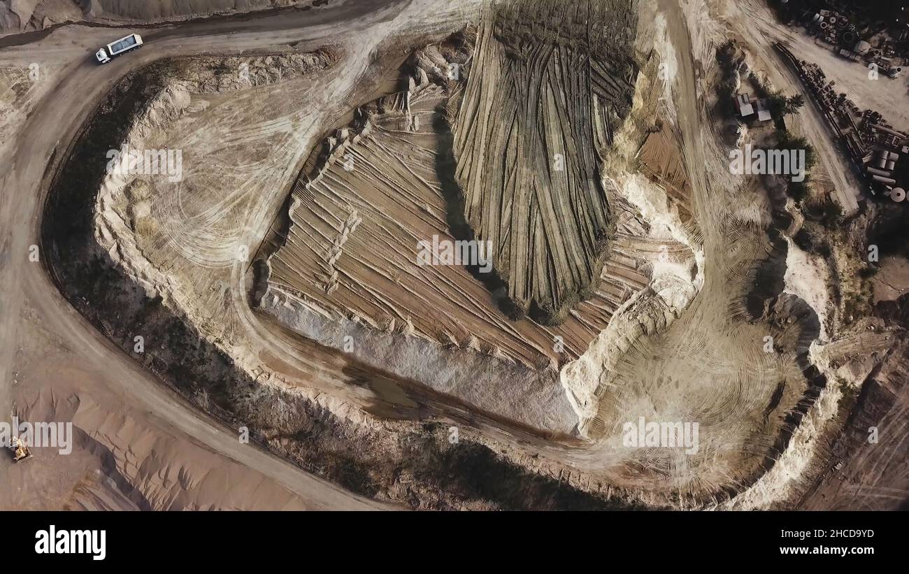 Aerial view of gravel quarry with many machine traces. Top view of ...