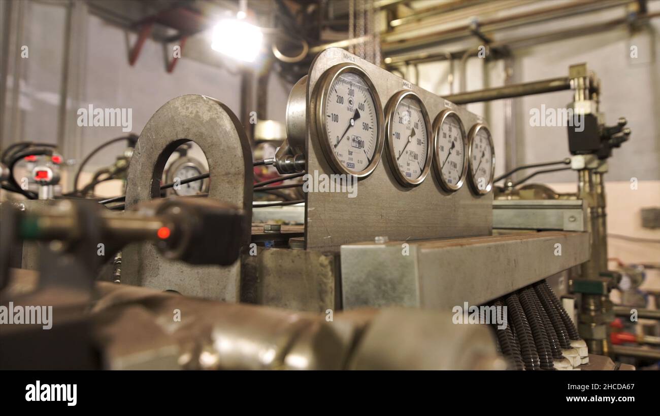 Close up of manometers, pipes and faucet valves of heating system in a ...