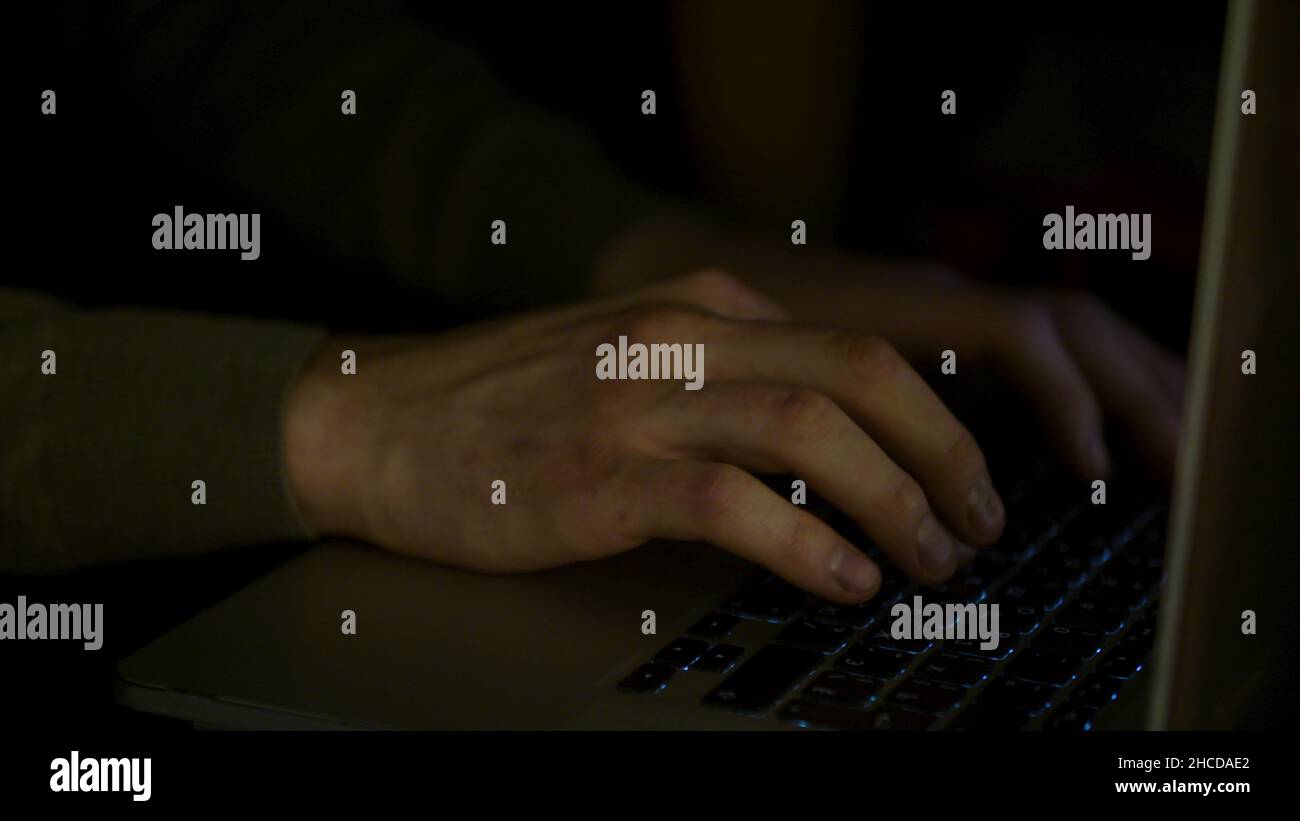 Close up for man hands typing fast on laptop computer, business ...