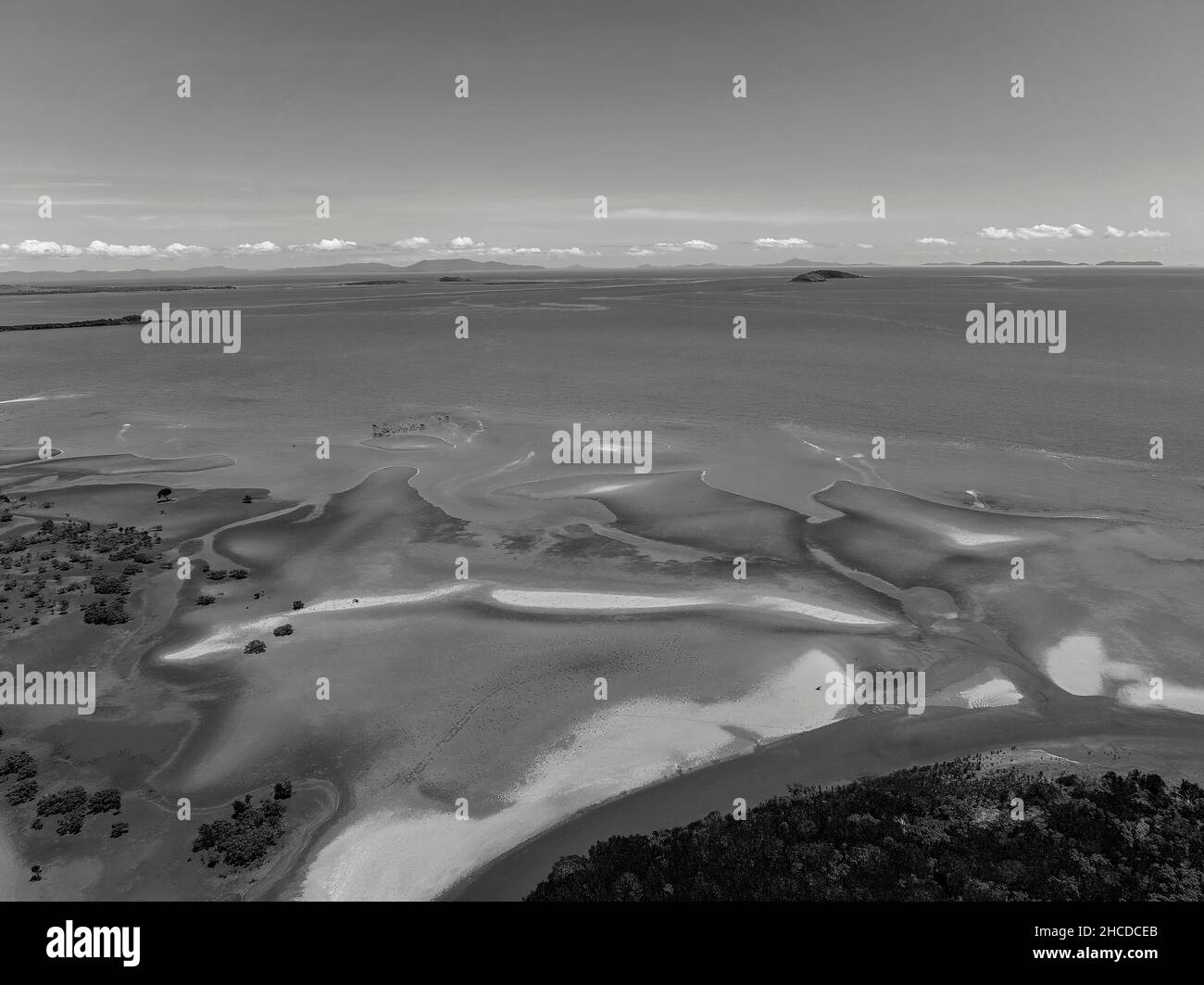 Aerial landscape pattern of ocean sands at low tide towards horizon ...