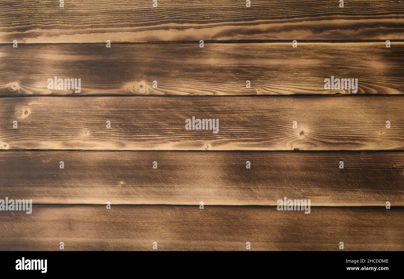 the background is made of burnt boards with the texture of natural wood ...