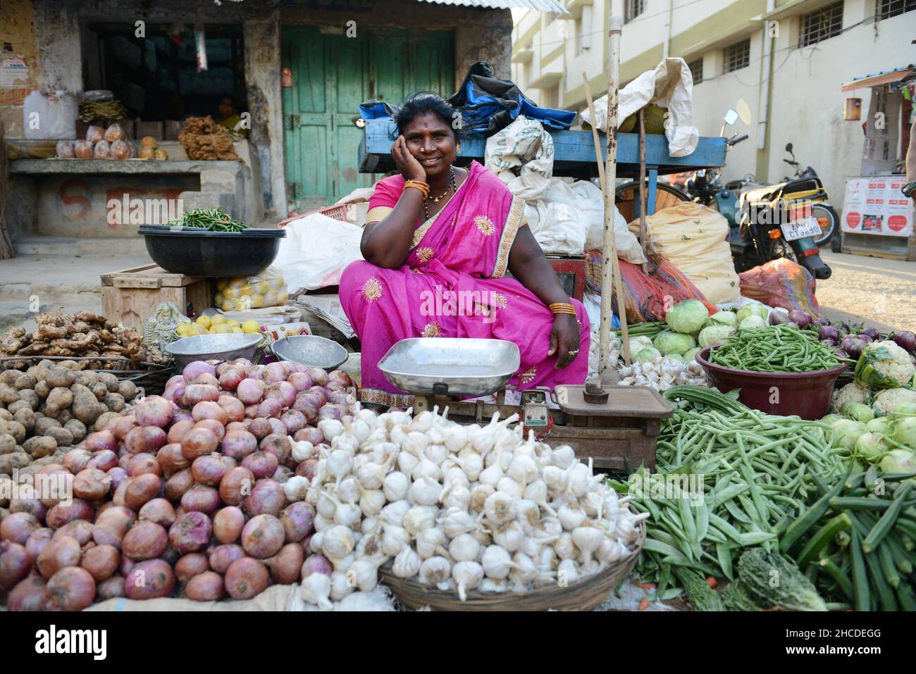 A vegetable vendor and the outdoor market in Kuppam, Andhra Pradesh ...