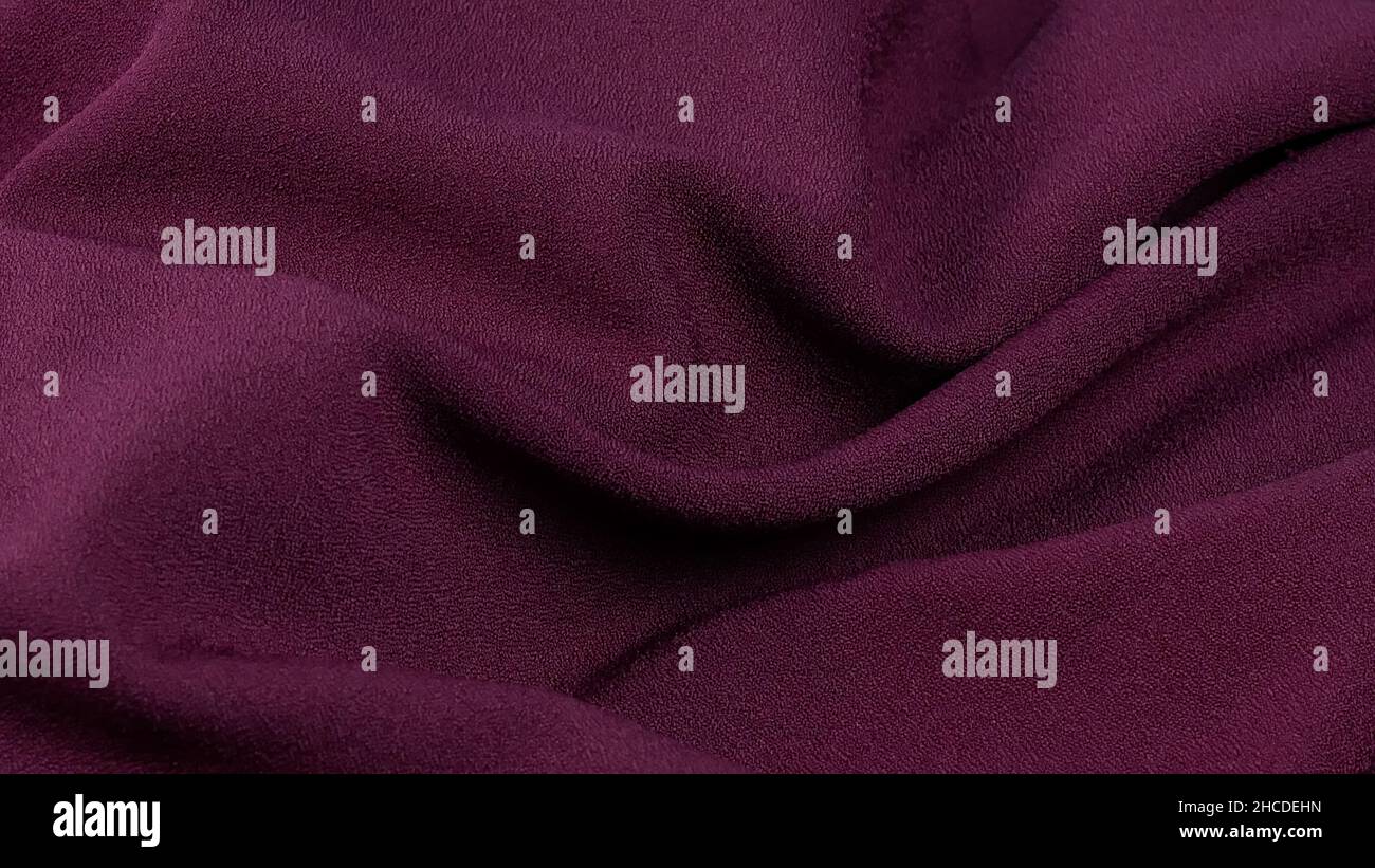 elegant dark maroon fabric texture, wrinkled fabric as a background ...