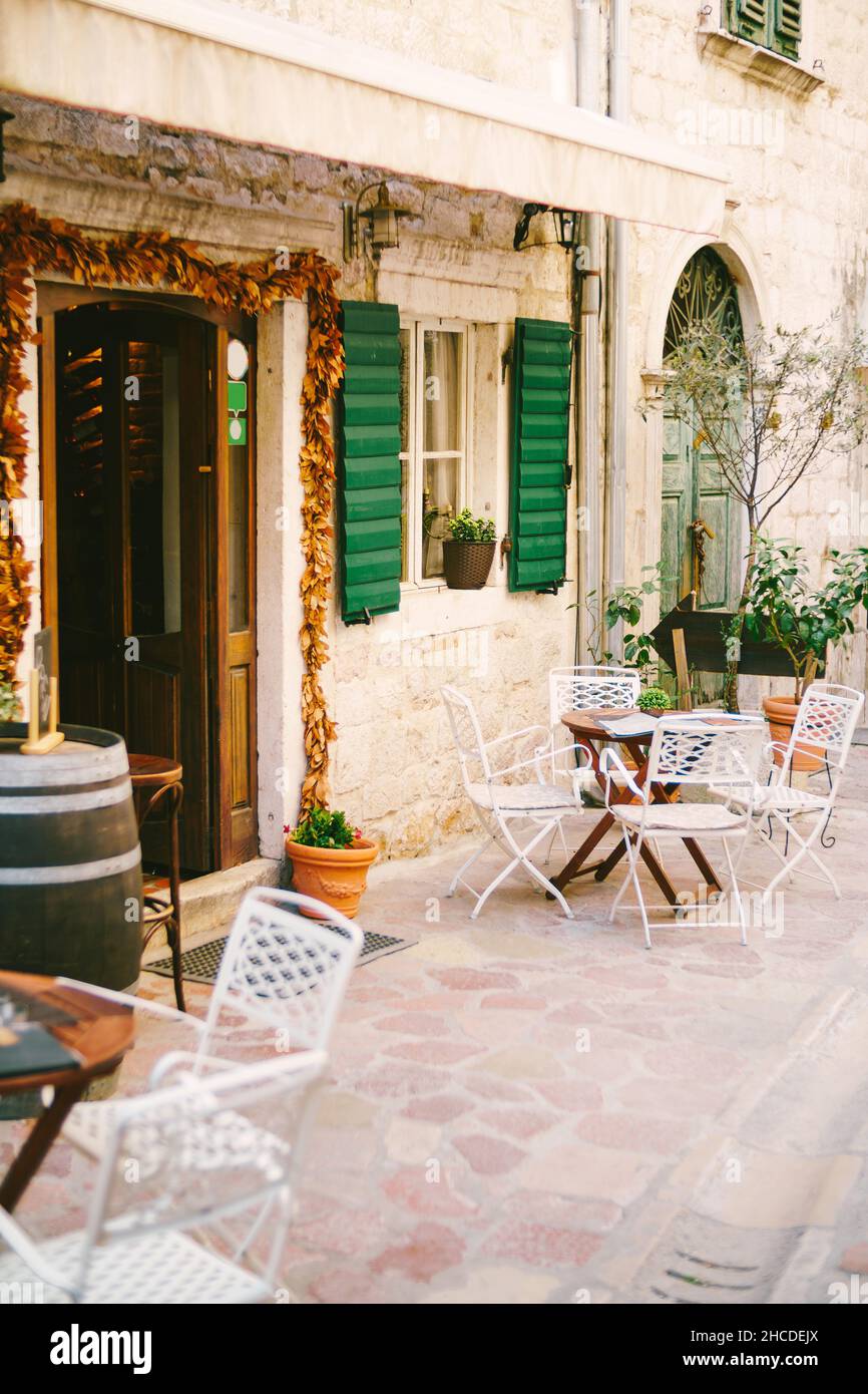 Wooden tables near the walls of a rustic cafe Stock Photo - Alamy