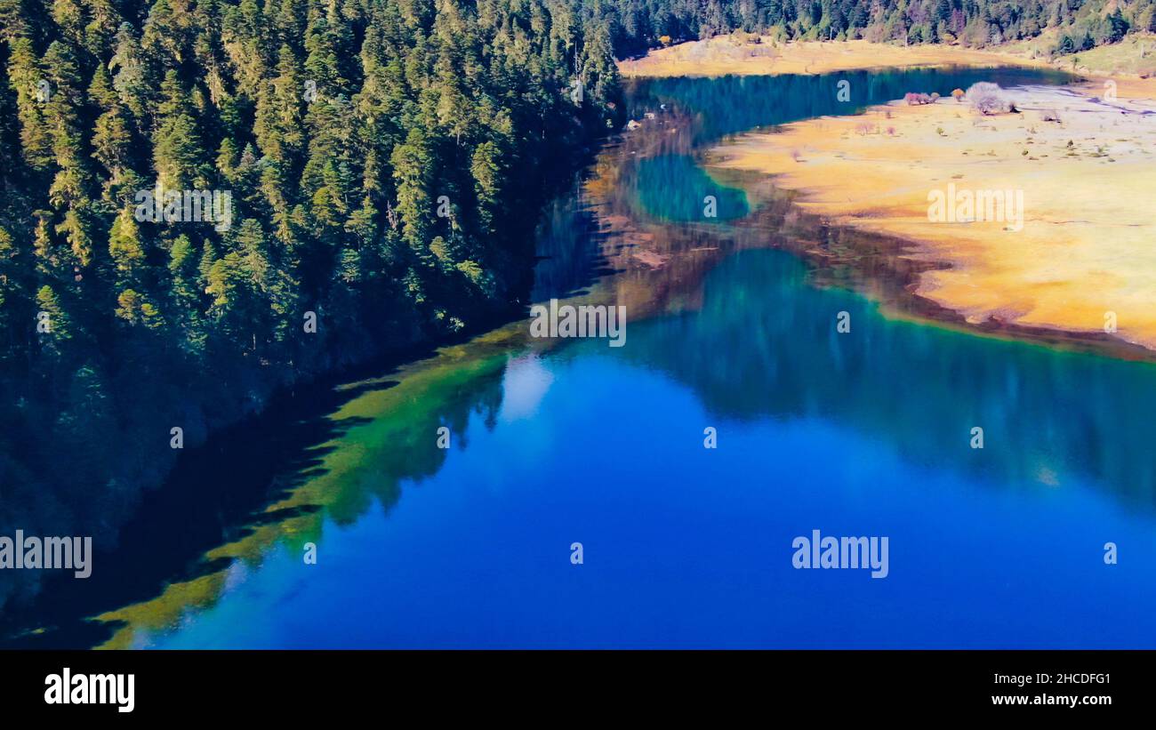 DIQING, CHINA - OCTOBER 26, 2021 - Green waters of bottomless Lake ...