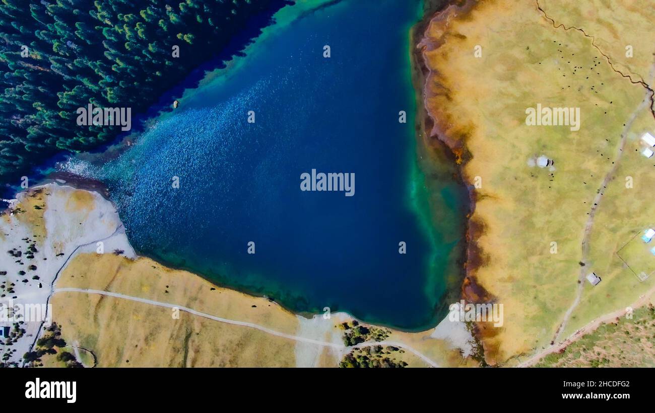 DIQING, CHINA - OCTOBER 26, 2021 - Green waters of bottomless Lake ...