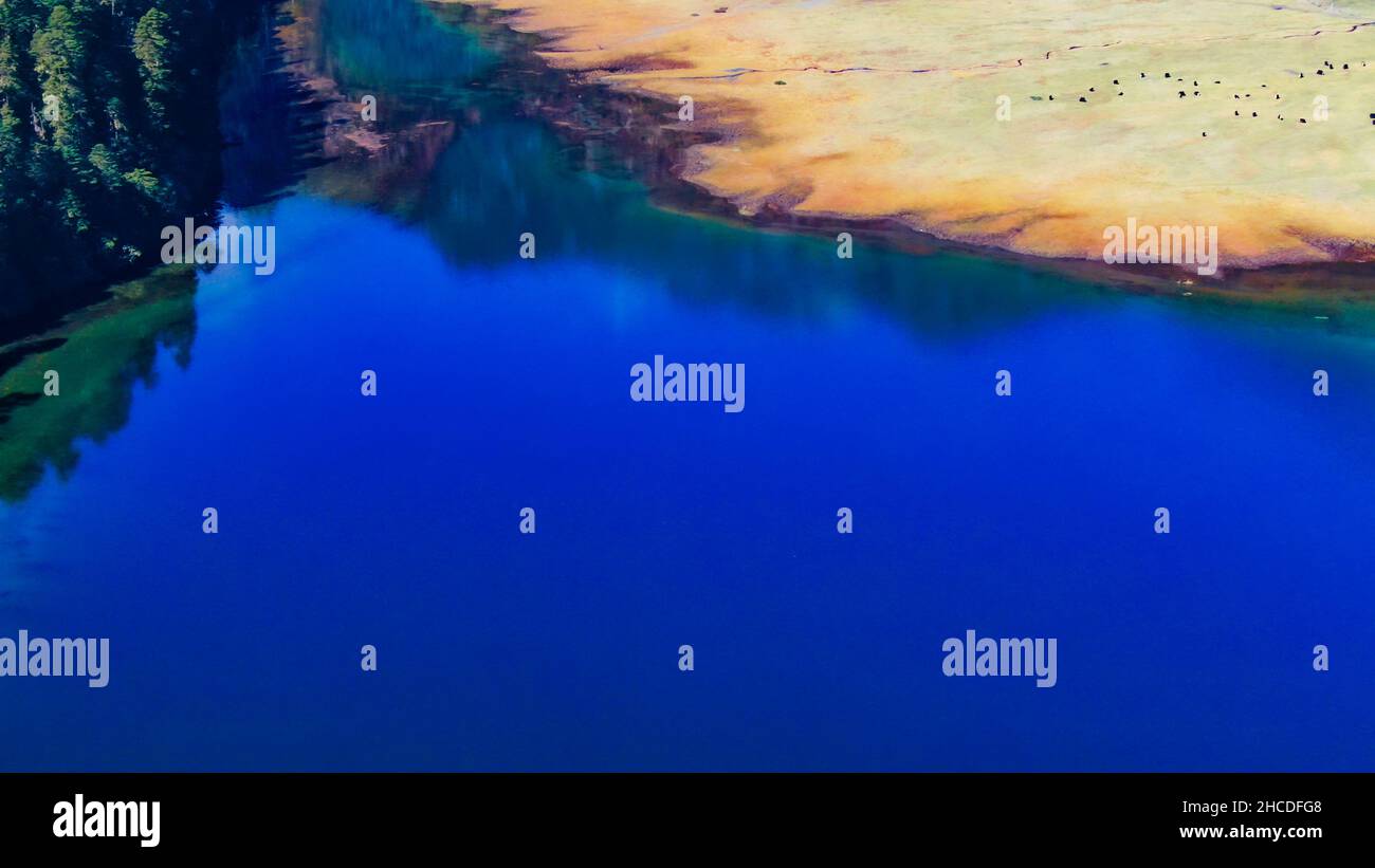 DIQING, CHINA - OCTOBER 26, 2021 - Green waters of bottomless Lake ...