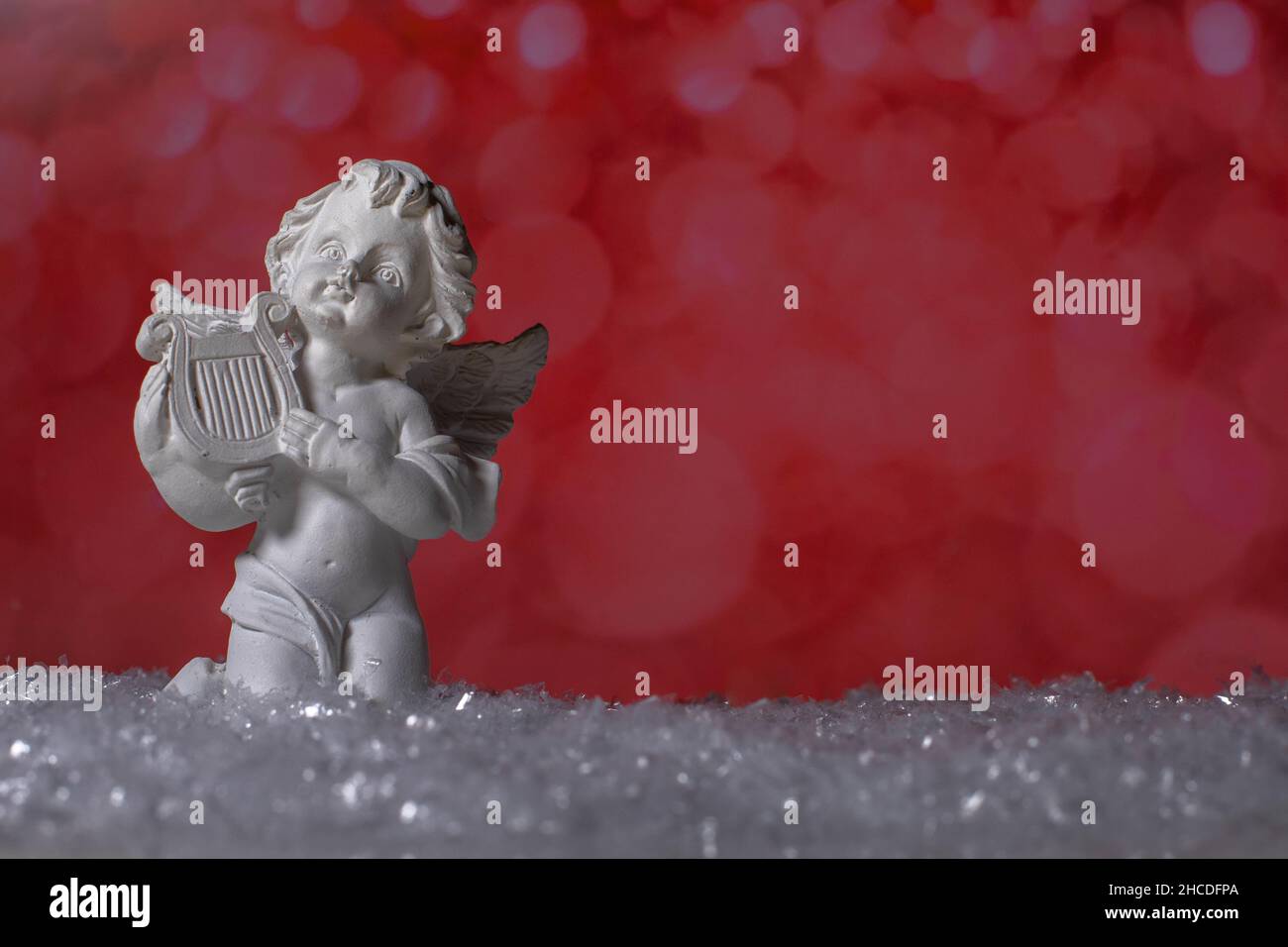 Ceramic angel statue standing on snow Stock Photo - Alamy