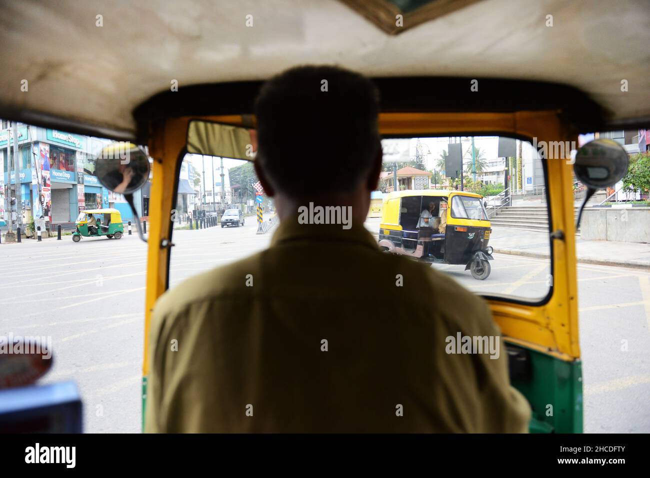 New auto rickshaws in Bangalore running on green energy Stock Photo - Alamy