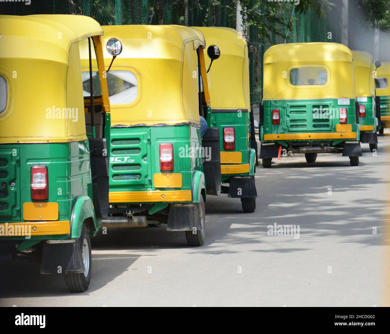 New auto rickshaws in Bangalore running on green energy Stock Photo - Alamy