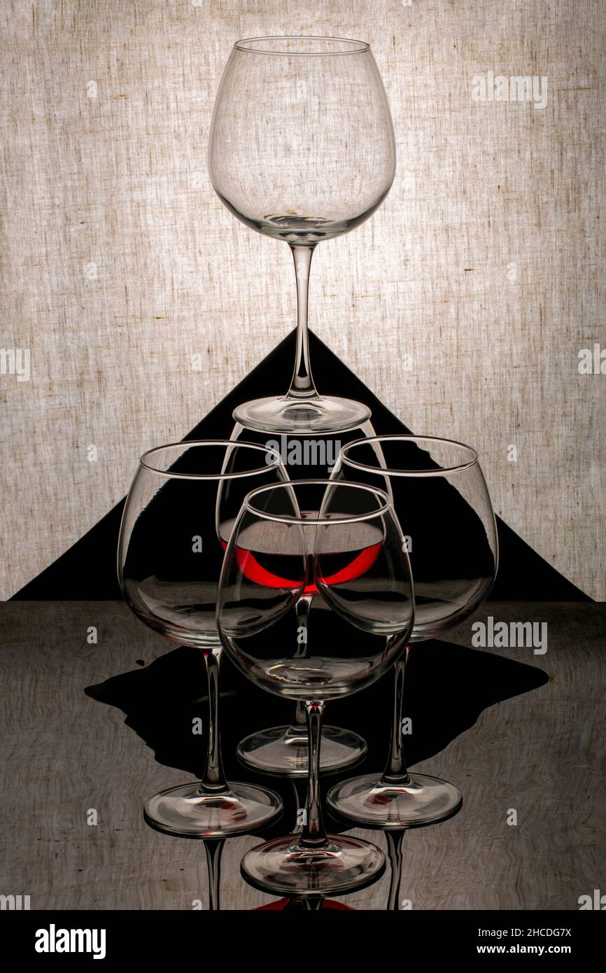 Geometric still life "Pyramid" with a glass of red wine Stock Photo - Alamy