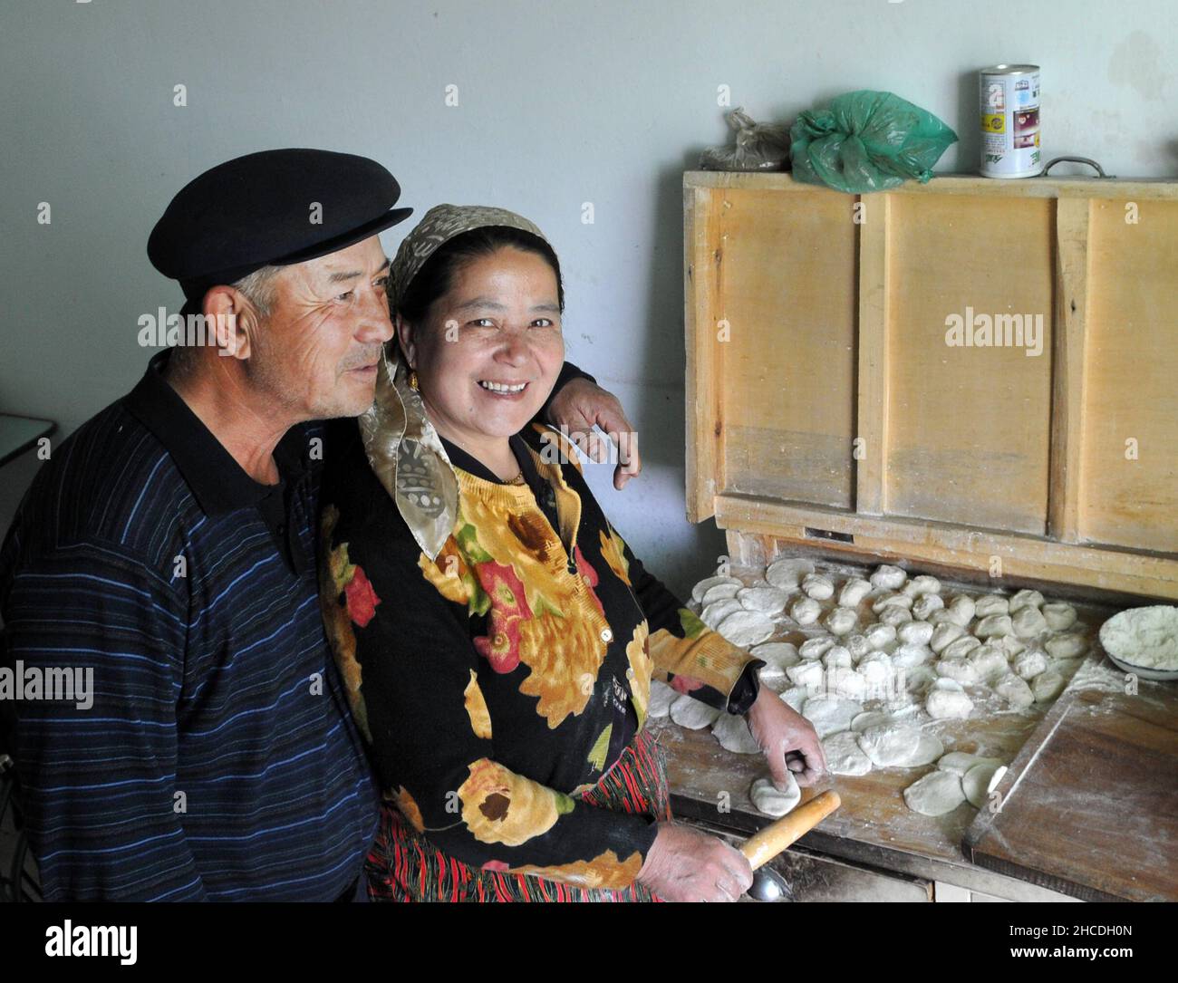 A Uyger woman prepares fresh dumplings for breakfast in Xinjiang China ...