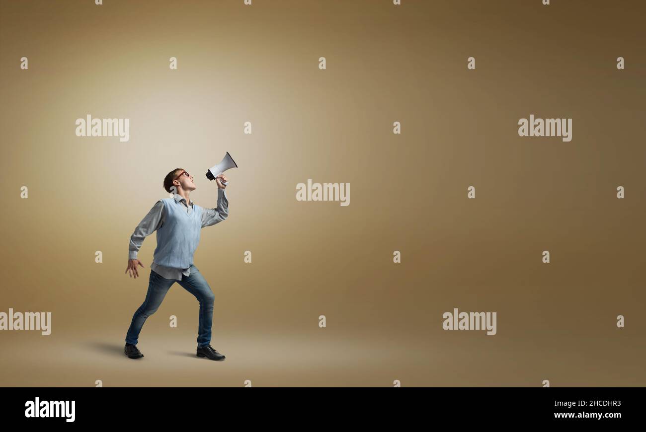 Boy with megaphone Stock Photo - Alamy