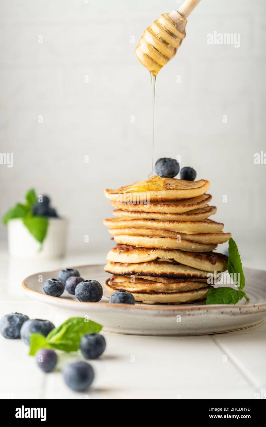 sweet pancakes for breakfast in a stack. on a ceramic plate. with fresh ...