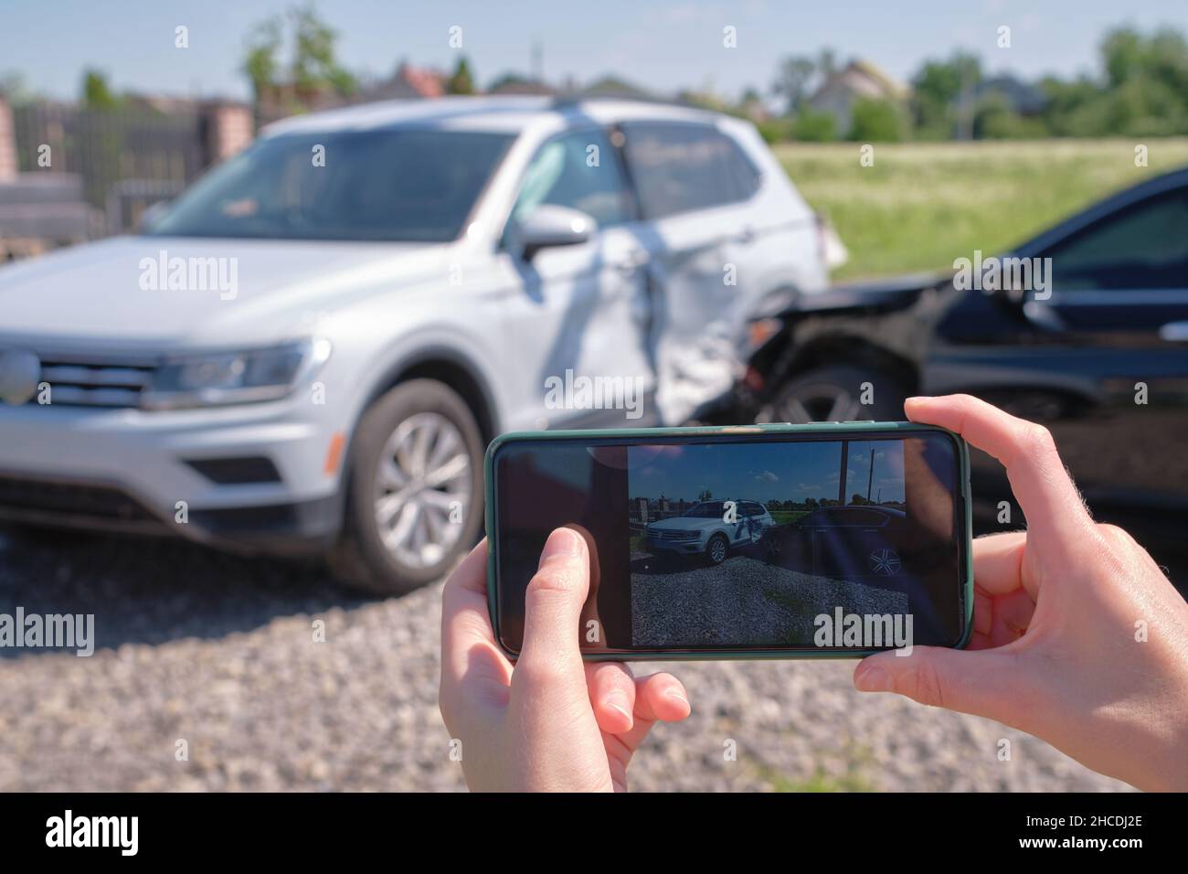 Driver hands taking photo on mobile phone camera after vehicle ...