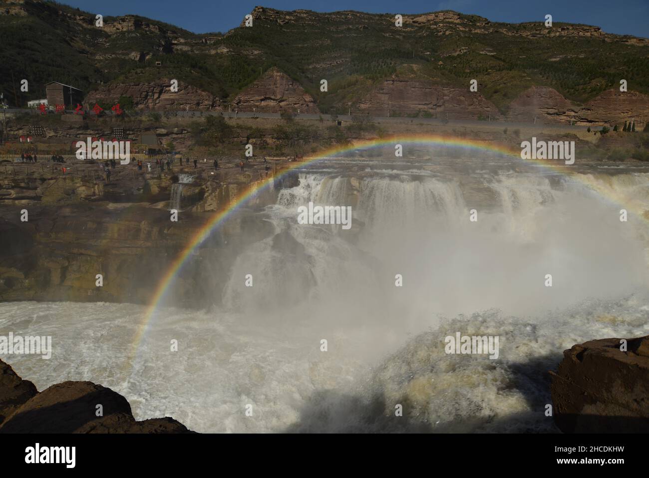 Tourists enjoy Rainbow Bridge at Hukou Waterfall Scenic Spot on the ...