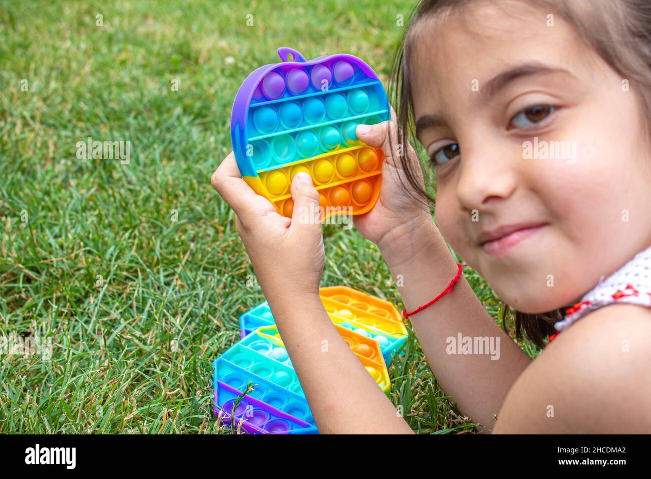 The child plays anti-stress pop it .Selective focus.toy Stock Photo - Alamy