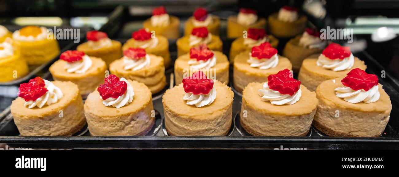 Cake displayed in shop window of confectionery or cafe. Fresh pastries ...