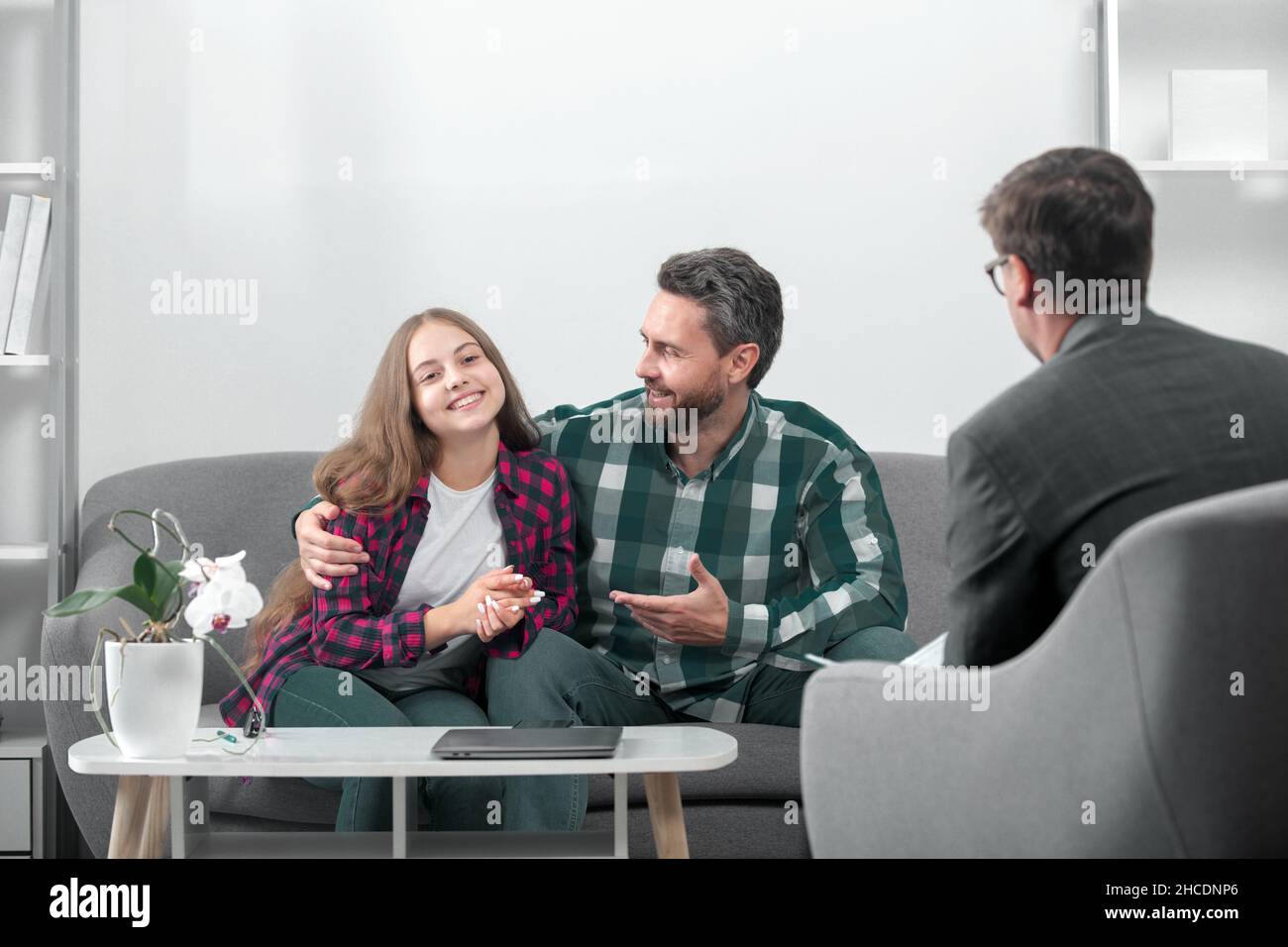 Psychologist helping father with daughter to solve child problems ...