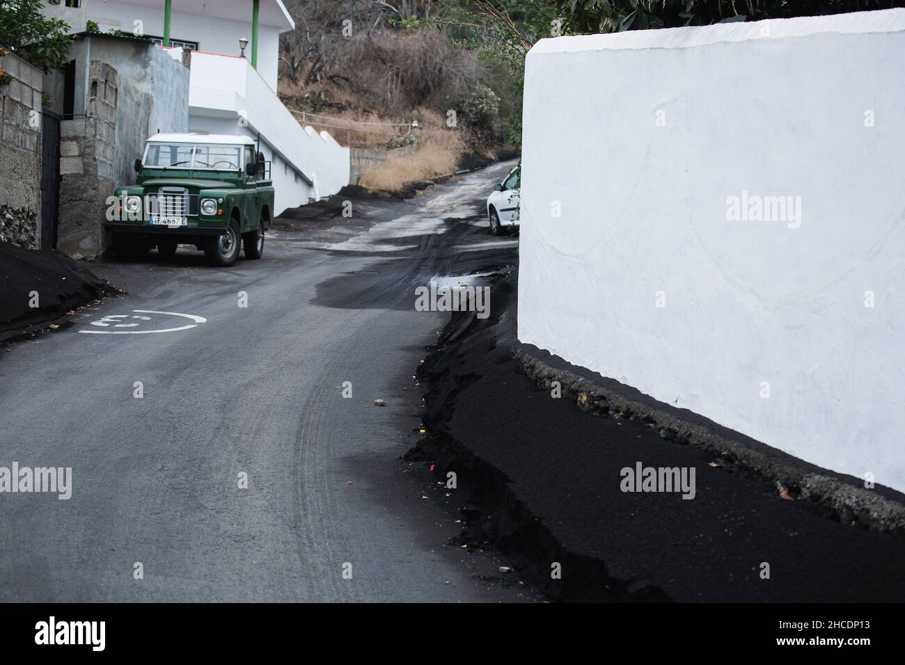 Volcanic ash on the streets in urban environment after an eruption. Ash ...