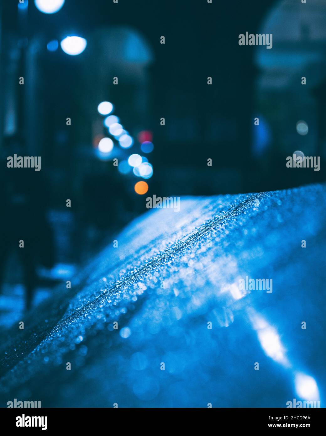 Wet railing at night during the rain with blurred background Stock ...