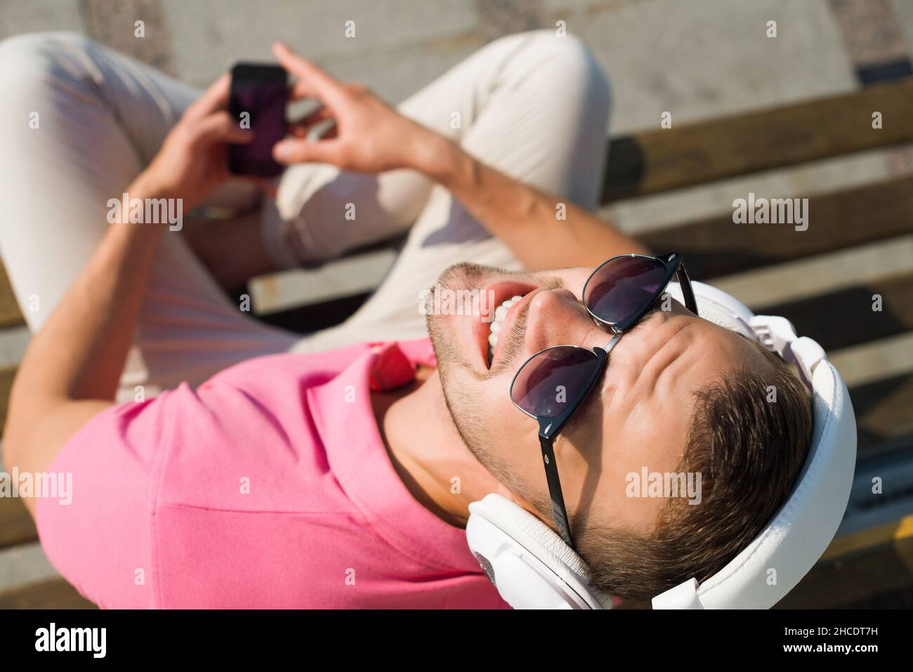 Handsome guy on bench Stock Photo - Alamy