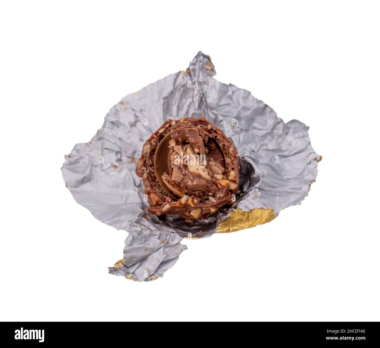 Norwich, Norfolk, UK – December 2021. Close up of an unwrapped Ferrero ...