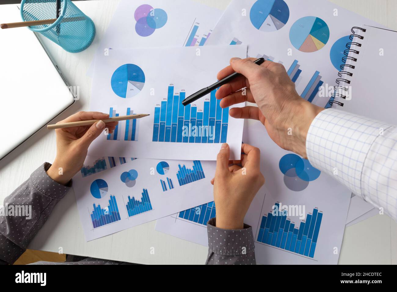 Hands of business people on the desktop. Analysis of financial data ...