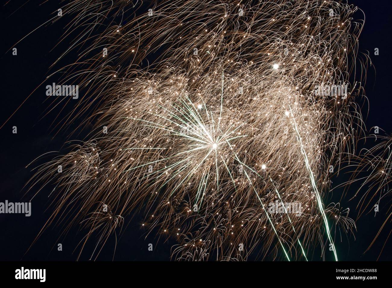 Closeup of fireworks exploding in the dark sky Stock Photo - Alamy