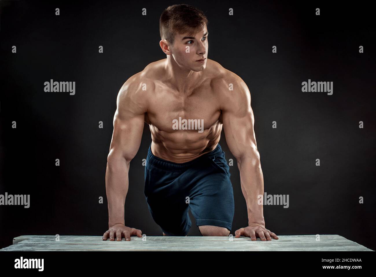 Young Muscular man flipping box Stock Photo - Alamy