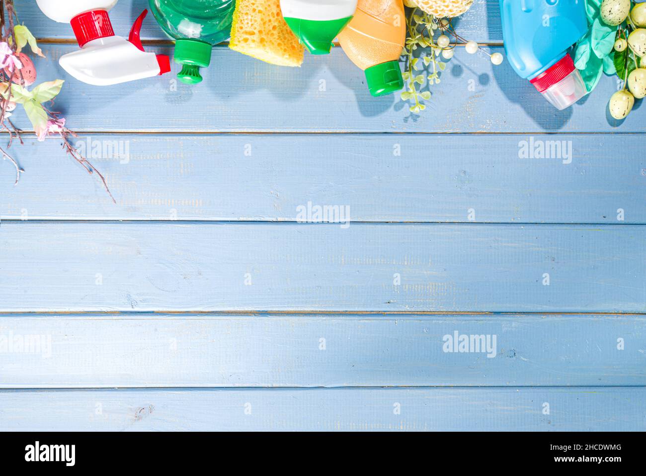 Spring cleaning concept. Sun lighted bright blue background with ...