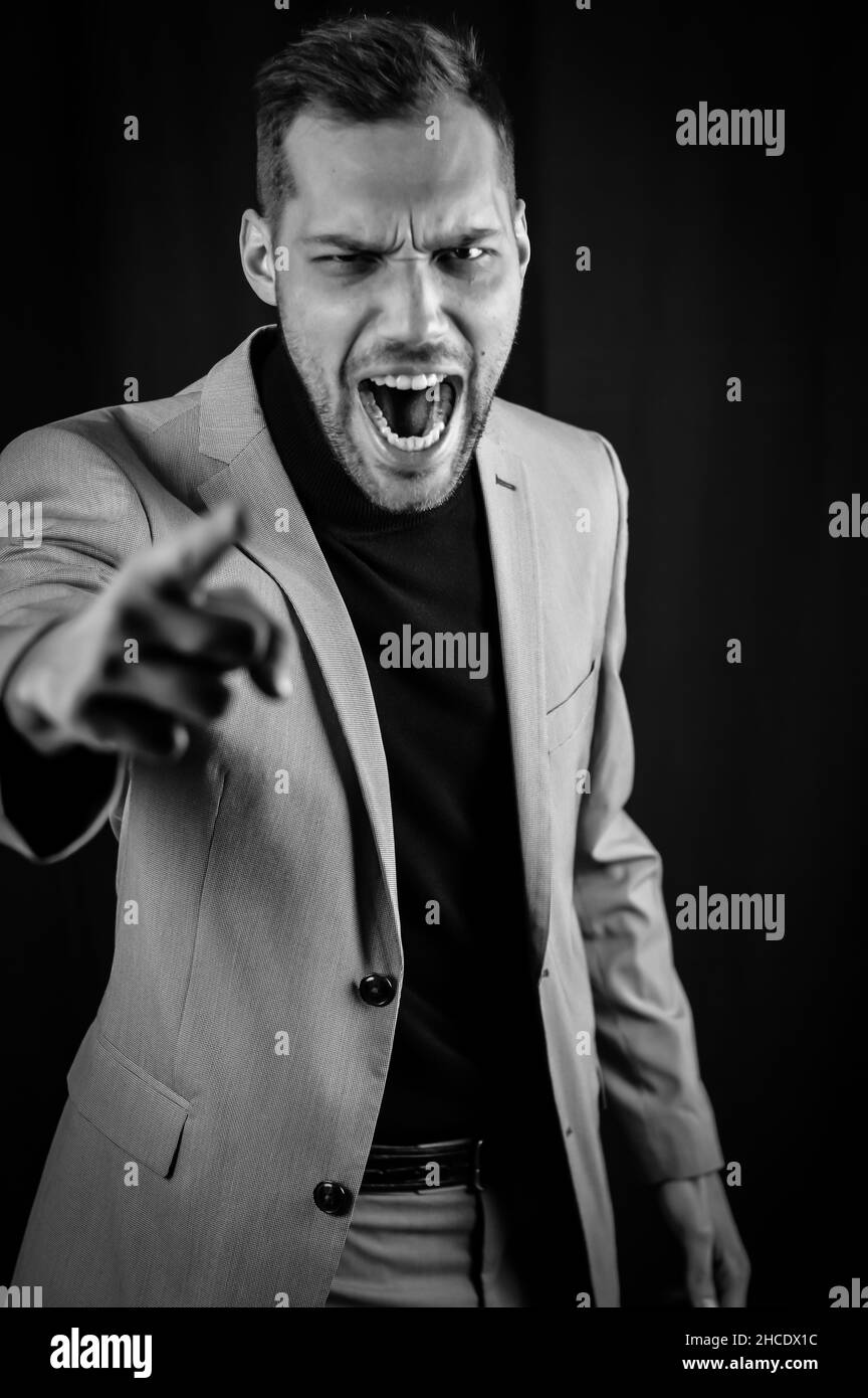 black and white portrait of a young businessman in a gray suit, very ...
