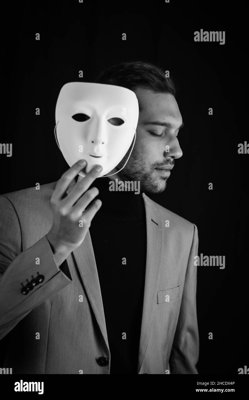 Hands black mask Black and White Stock Photos & Images - Alamy