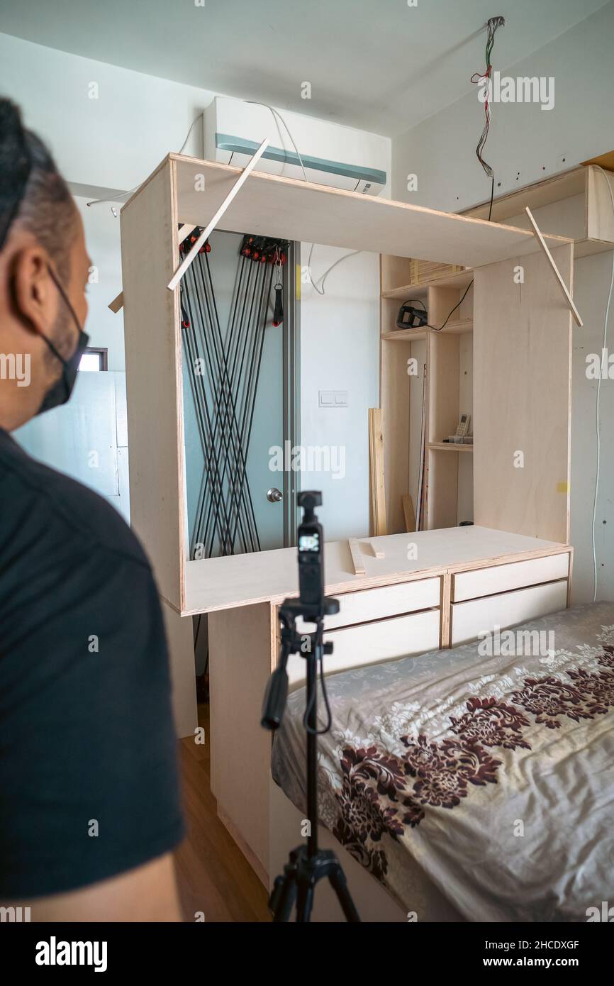 Handyman fixing wardrobe hi-res stock photography and images - Alamy