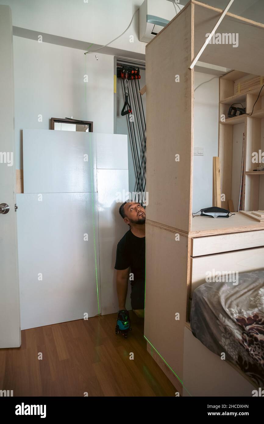 Man assembling wooden wardrobe home hi-res stock photography and images ...