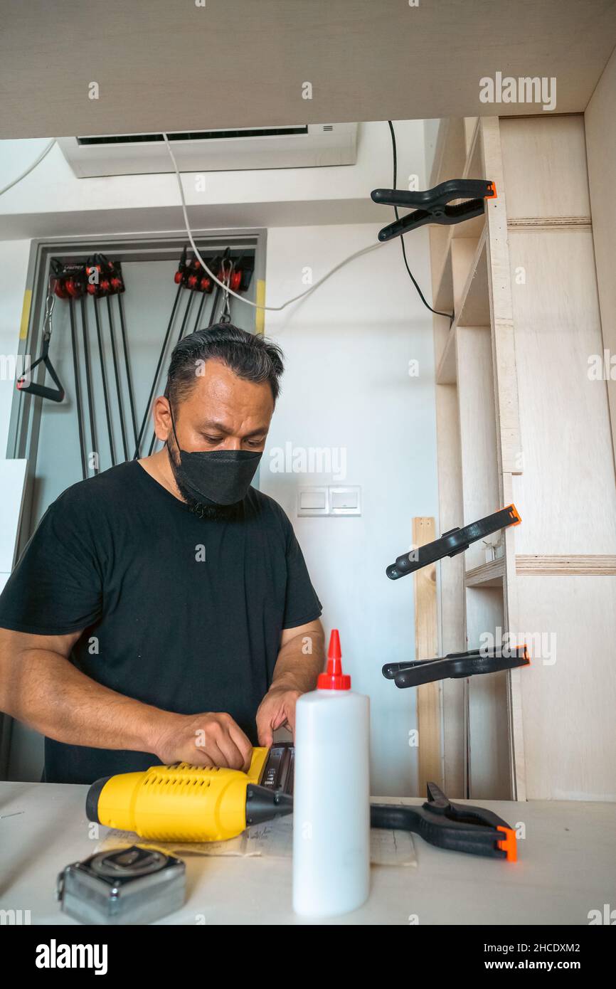 Man DIY wood project at home Stock Photo - Alamy