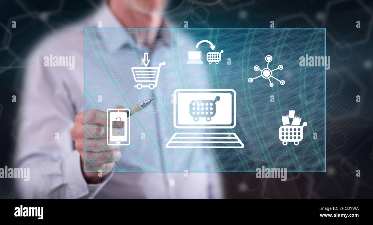 Man touching an online shopping concept on a touch screen with a pen ...