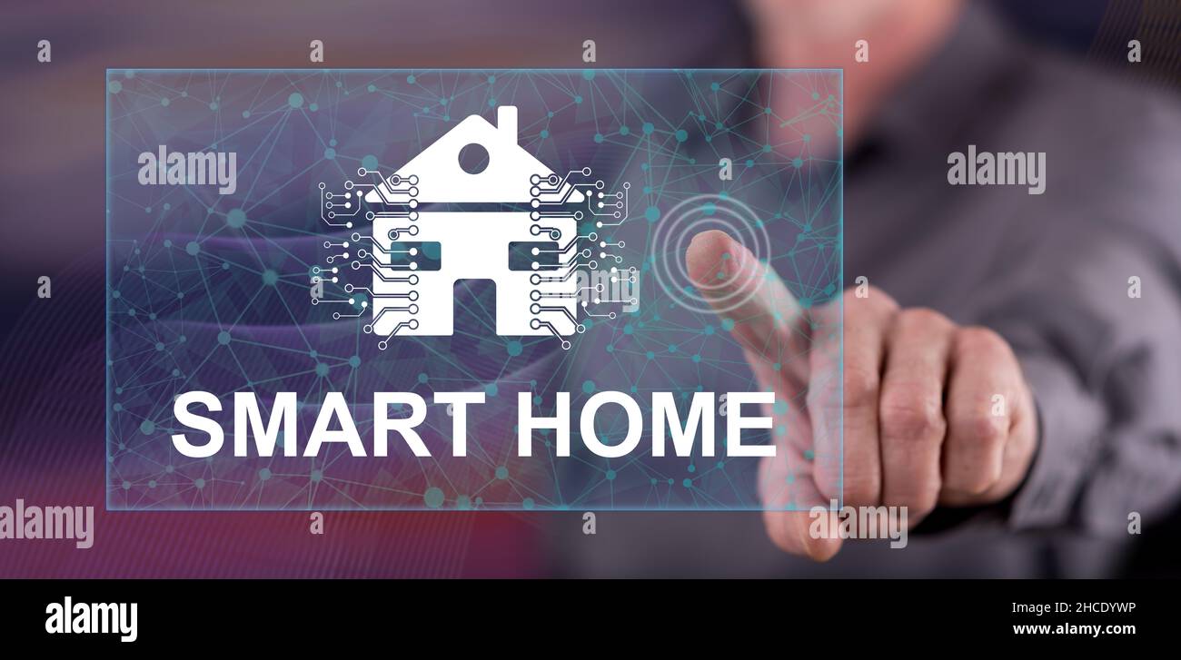 Man touching a smart home concept on a touch screen with his finger ...