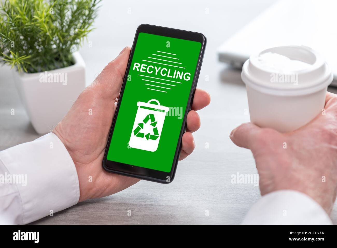 Smartphone screen displaying a recycling concept Stock Photo - Alamy