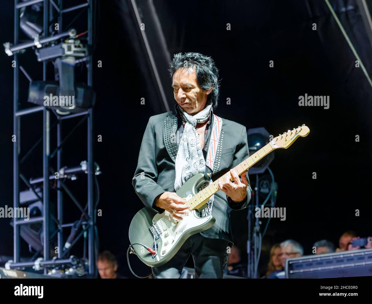 Robin Le Mesurier performs, jamming on stage playing his Fender guitar ...